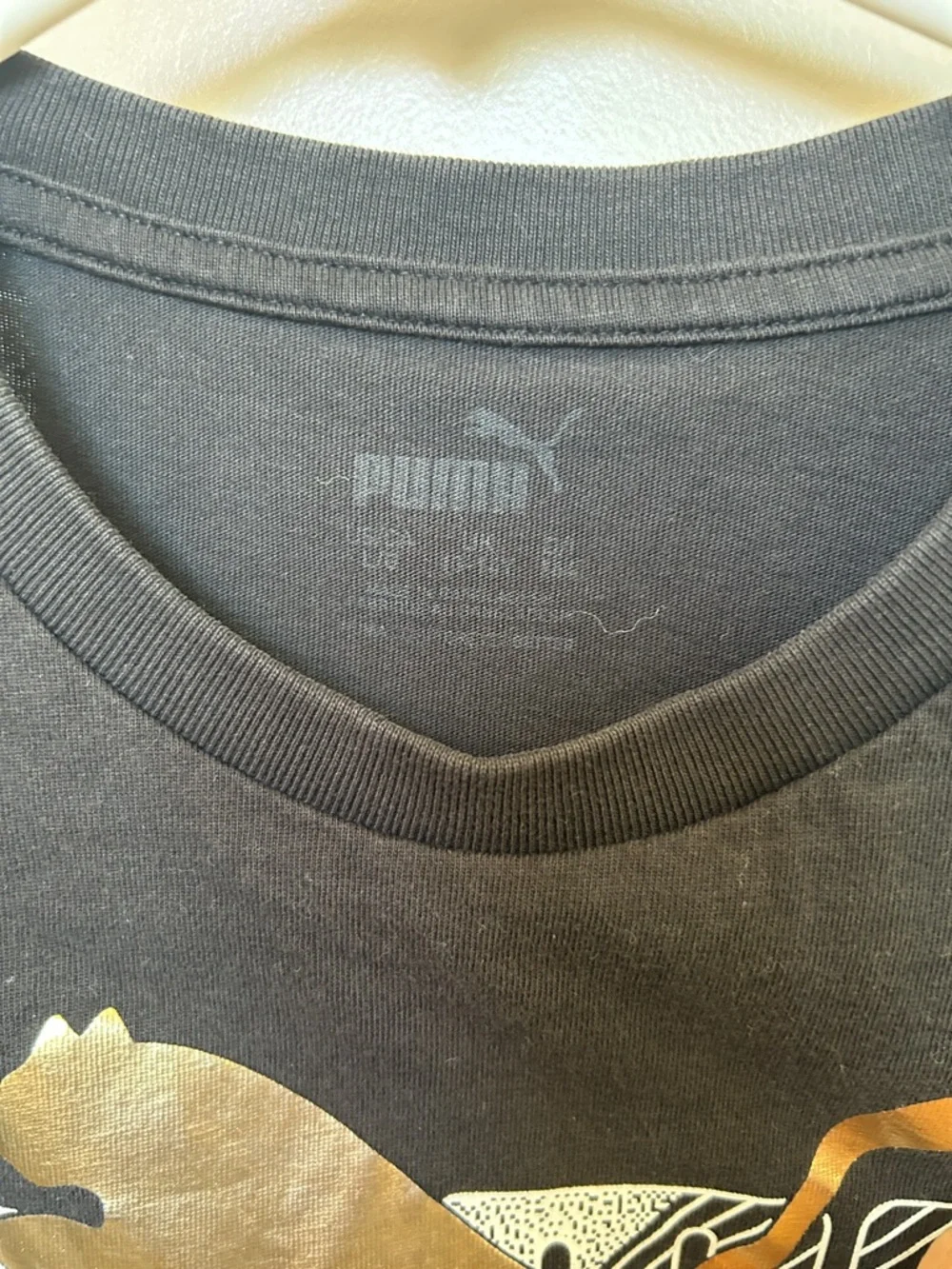 Puma | Shirts & Tops | Puma Black Tee With Gold Leaping Cat Logo | Poshmark